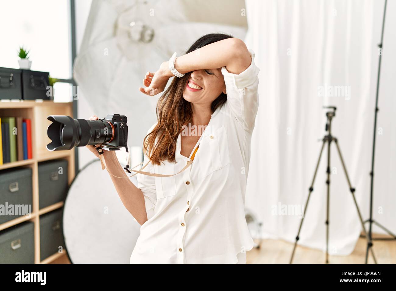 Playful woman playing peekaboo camera hi-res stock photography and ...