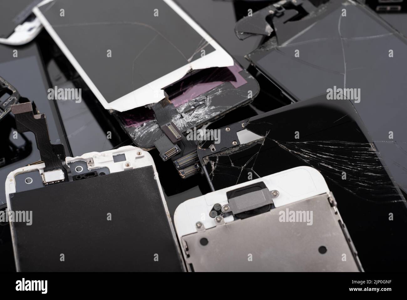 A heap with the various broken screens lying one on top of another ...