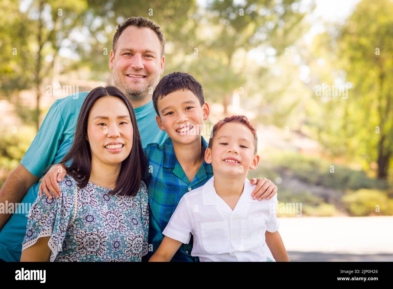 Outdoor portrait of mixed race Chinese and Caucasian family Stock Photo ...