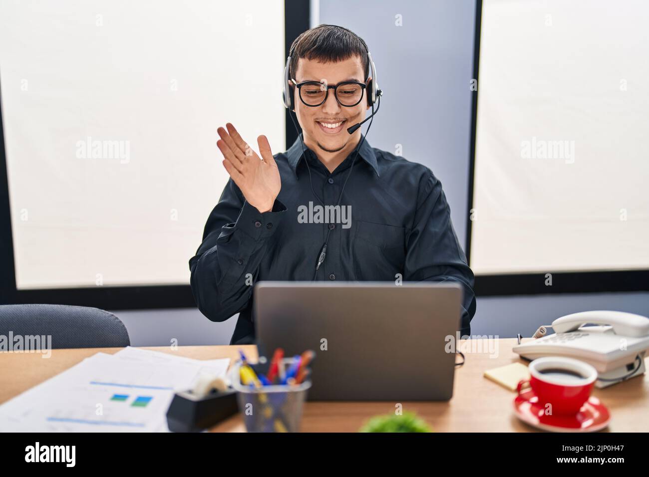 Young arab man wearing call center agent headset celebrating ...