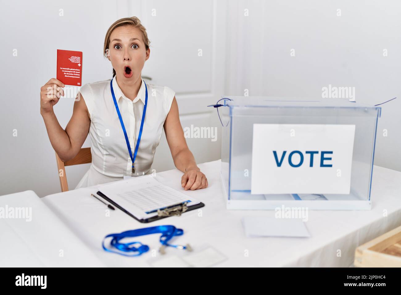 Young blonde woman at political campaign election holding swiss ...