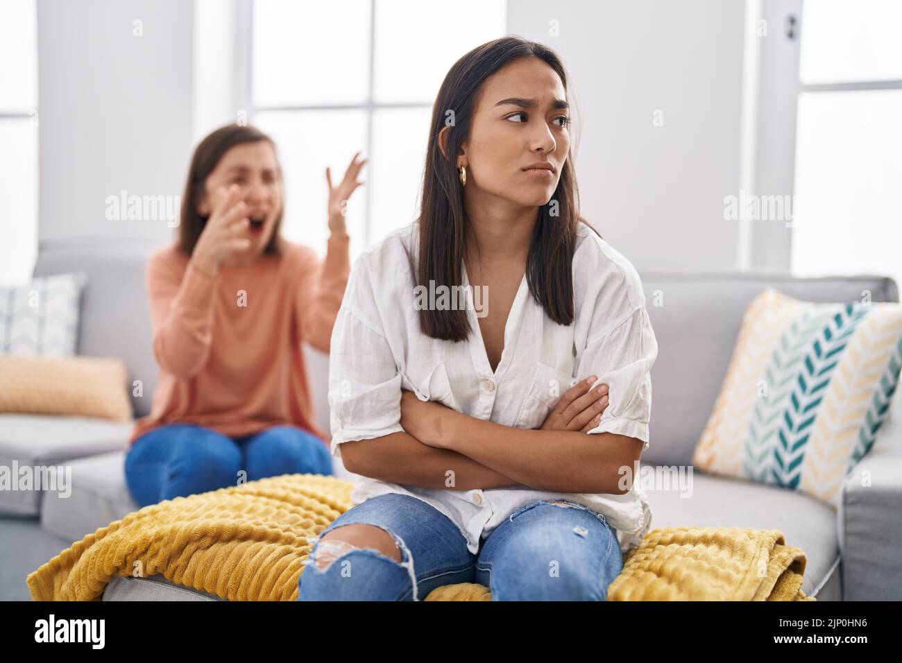 Two women mother and daughter arguing at home Stock Photo - Alamy