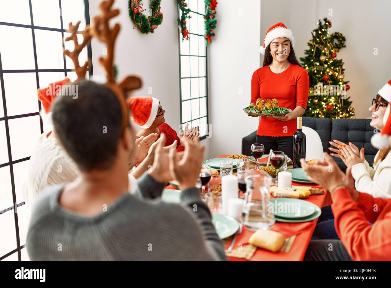 Group of people meeting clapping and sitting on the table. Woman ...