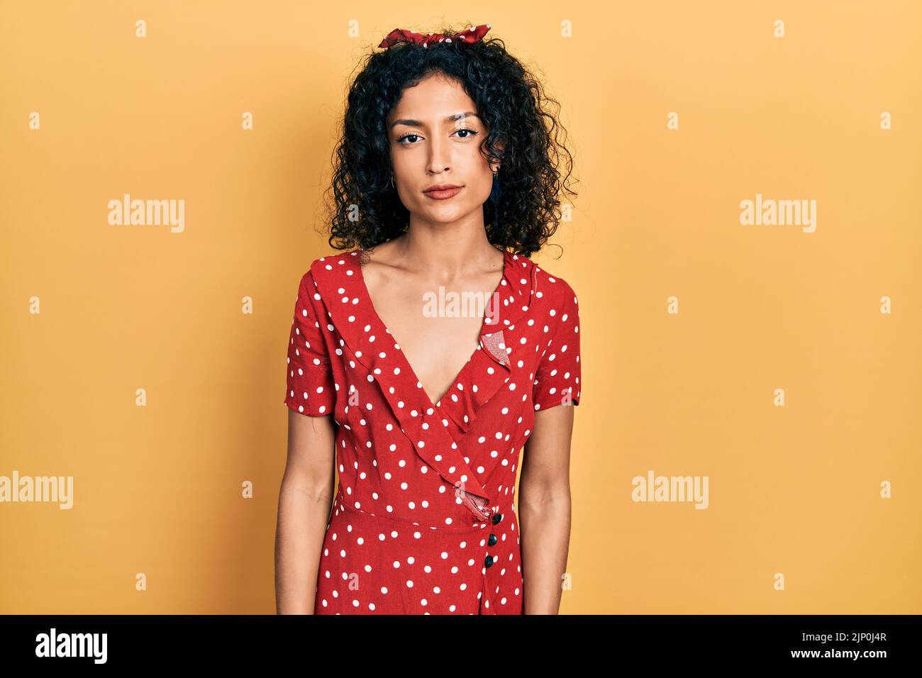 Young latin girl wearing summer dress looking sleepy and tired ...