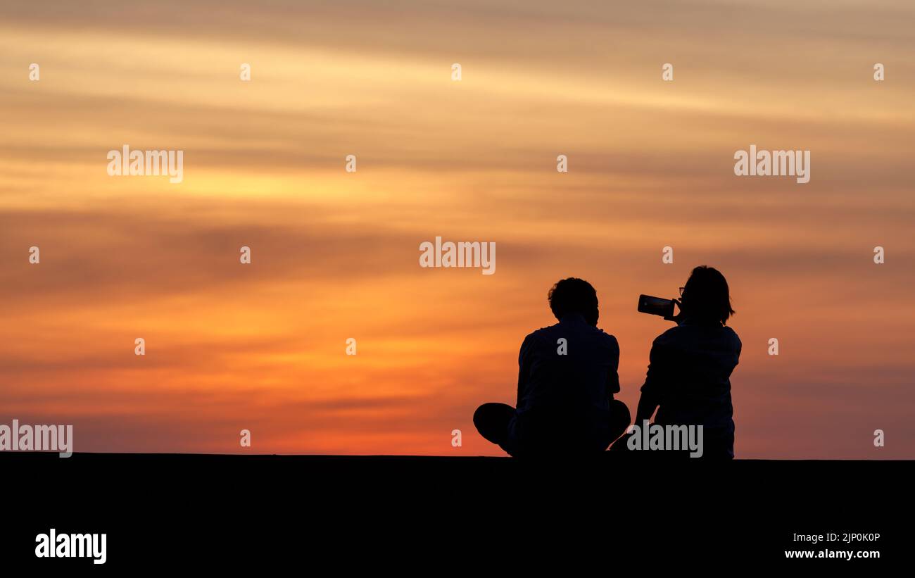 People Looking At The Sunset