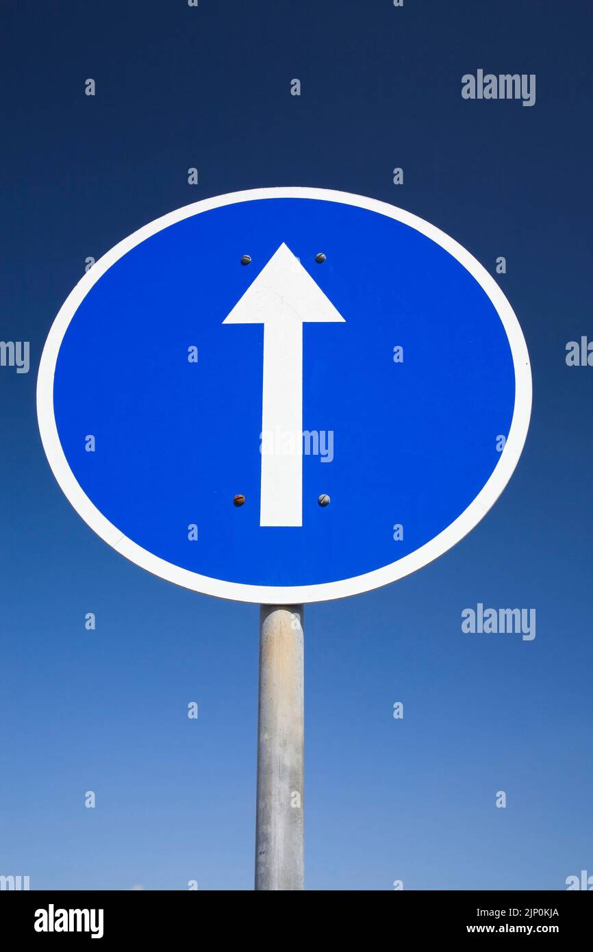 Circular blue sign with white arrow hi-res stock photography and images ...