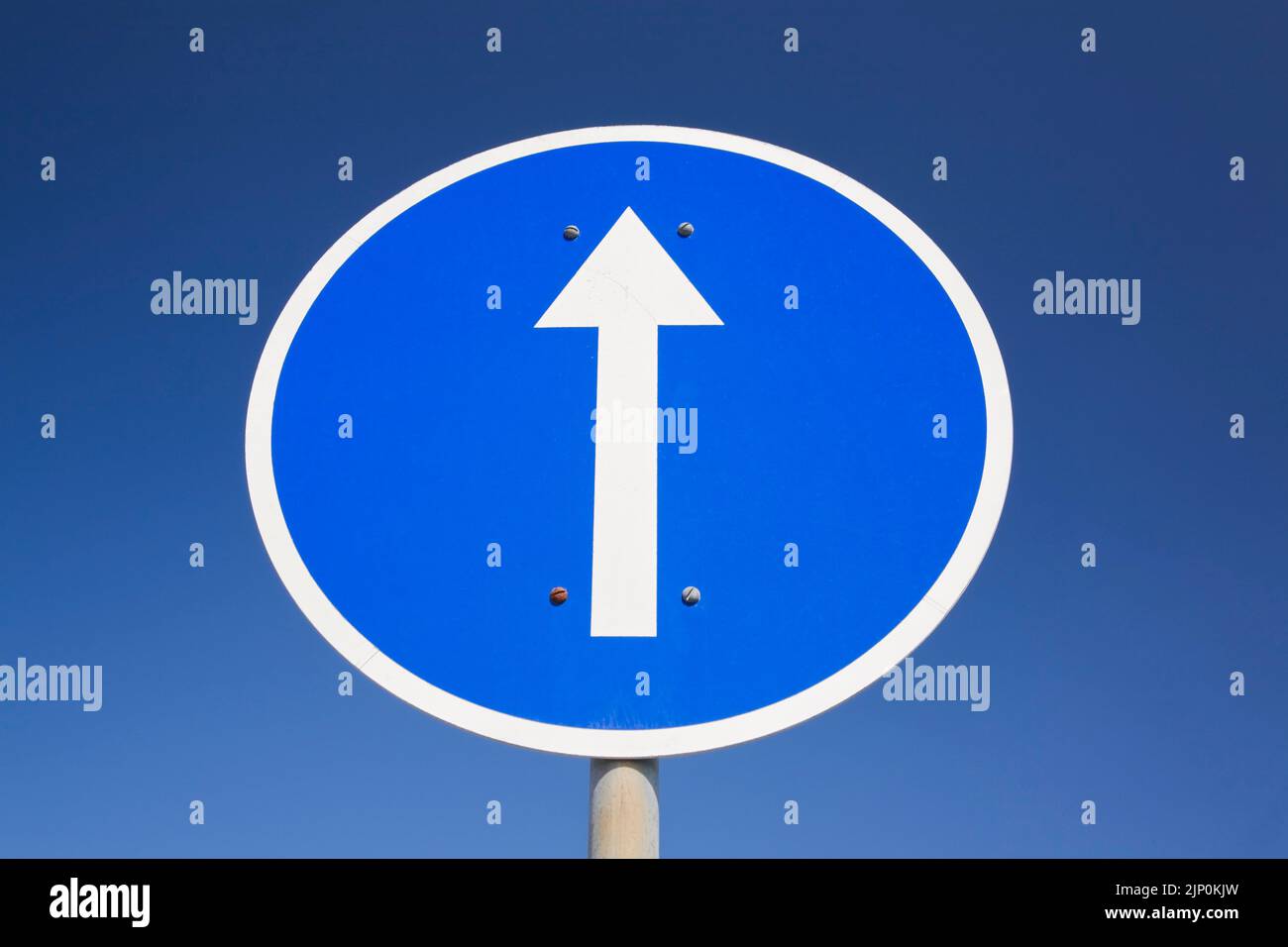 Circular blue sign with white arrow hi-res stock photography and images ...