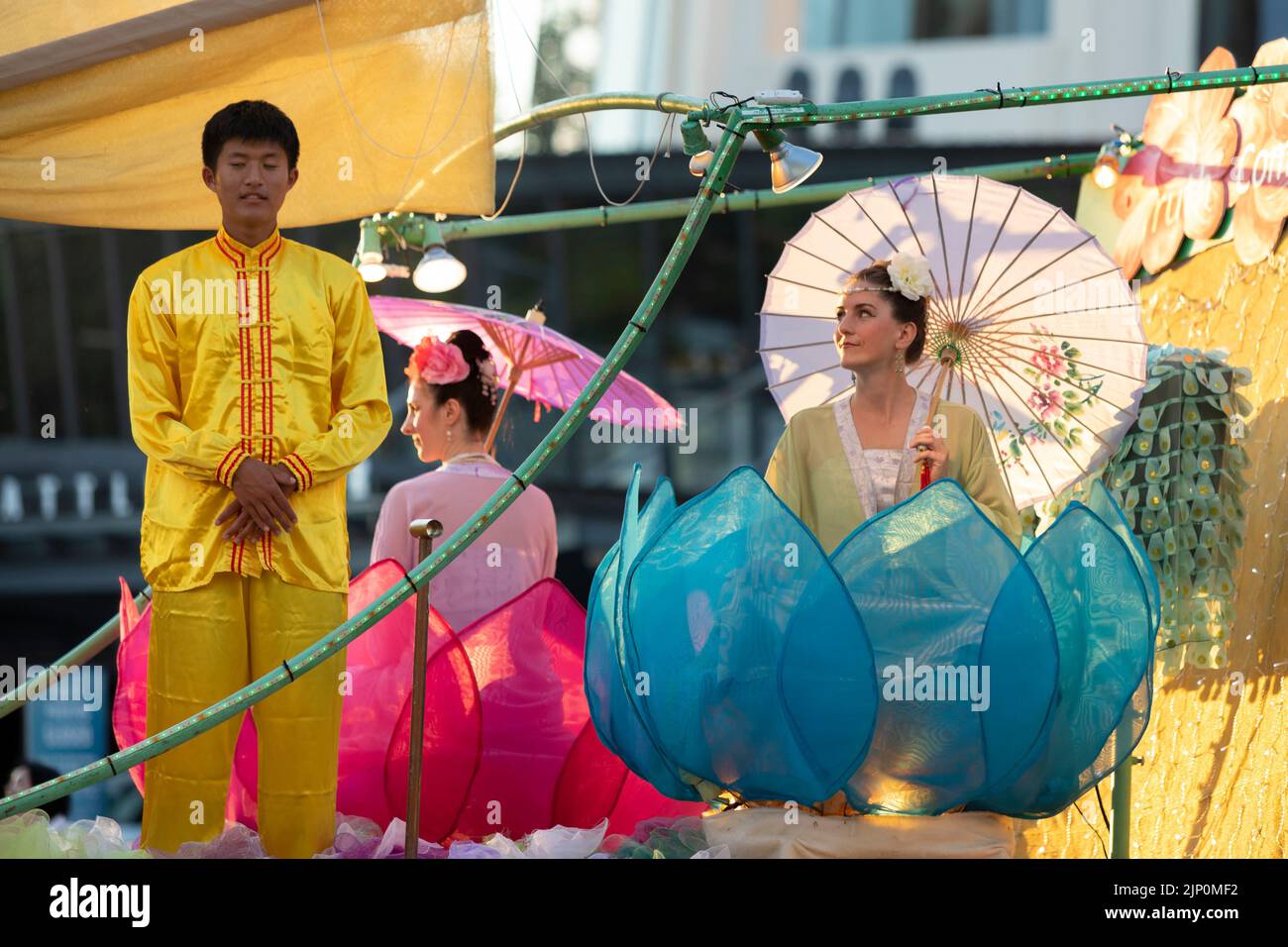 Falun Dafa practitioners ride a Ming Dynasty style float during the ...