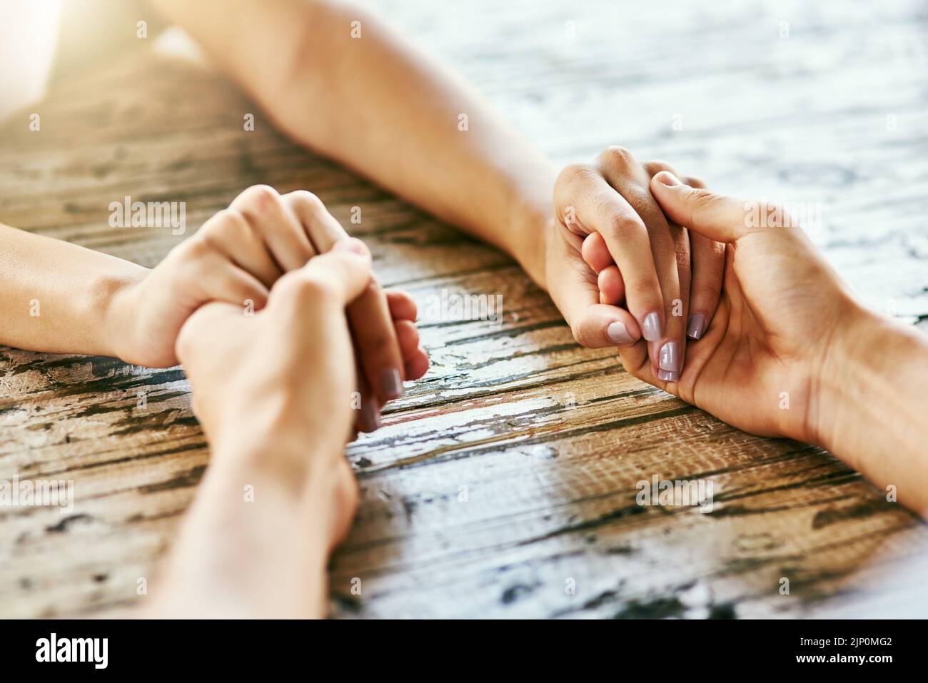 Two women one man holding hands hi-res stock photography and images - Alamy