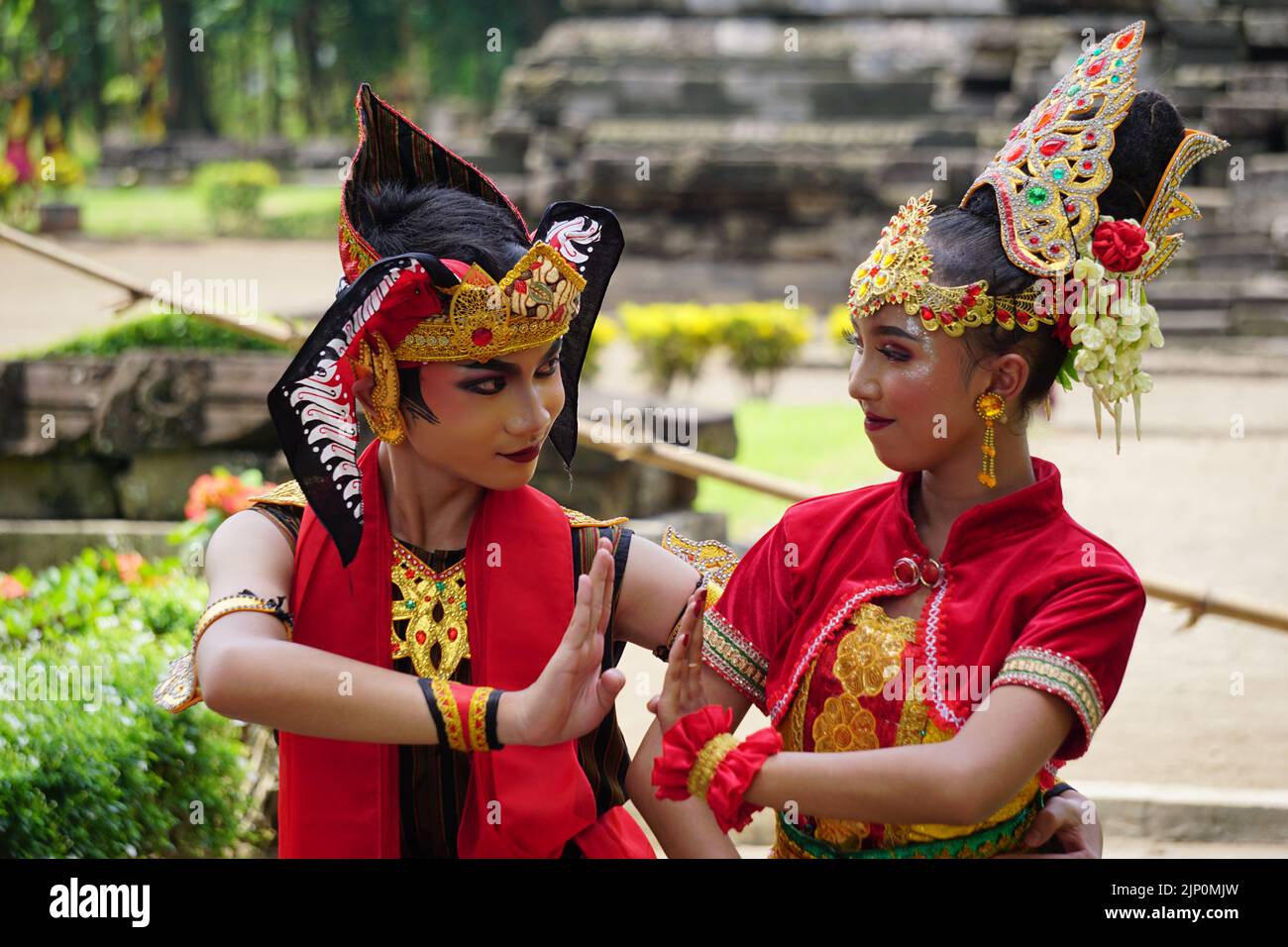 Indonesian dancers with traditional costumes are ready to perform to ...