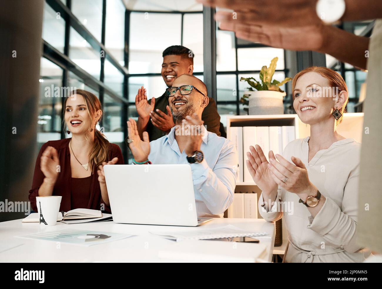 Professional team clapping hands, cheering during deal or meeting in ...
