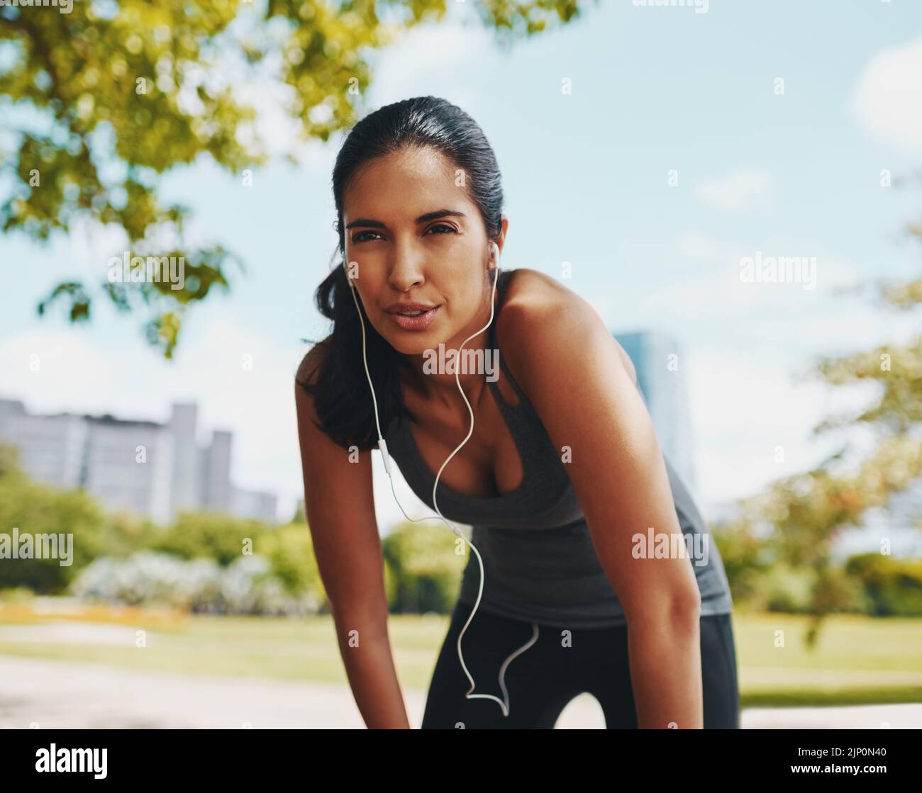 Tired but not defeated. an attractive young sportswoman taking a break ...