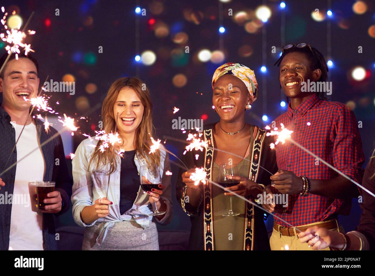 We find any occasion to celebrate. Portrait of a group of friends ...
