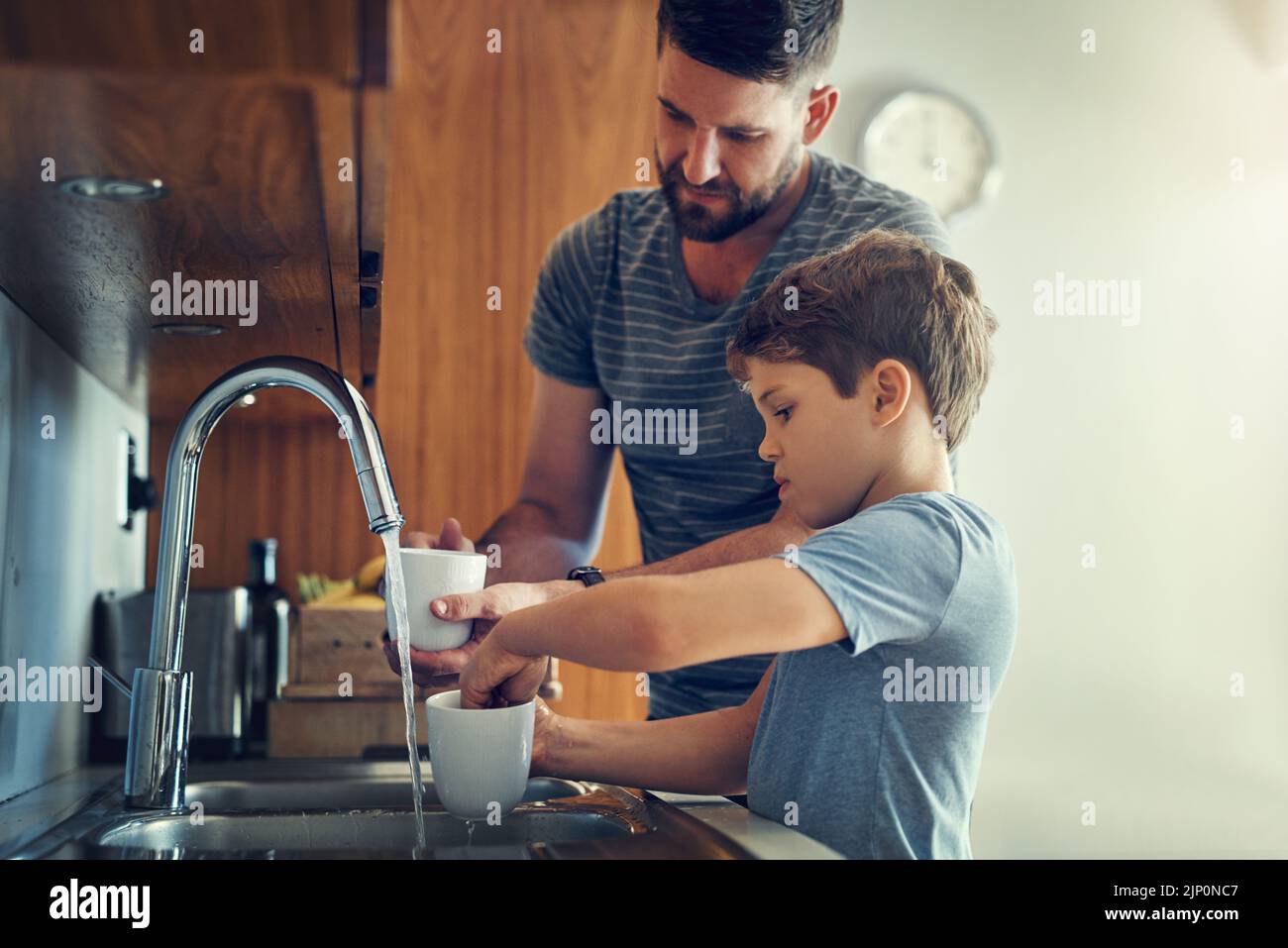 Father washing dishes hi-res stock photography and images - Alamy