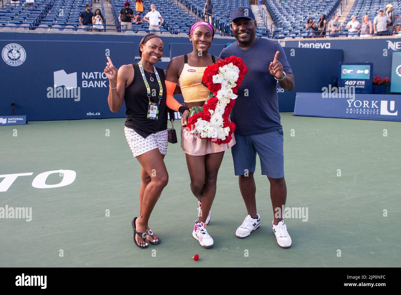 Coco Gauff, of the United States, centre, poses with her parents Candi ...