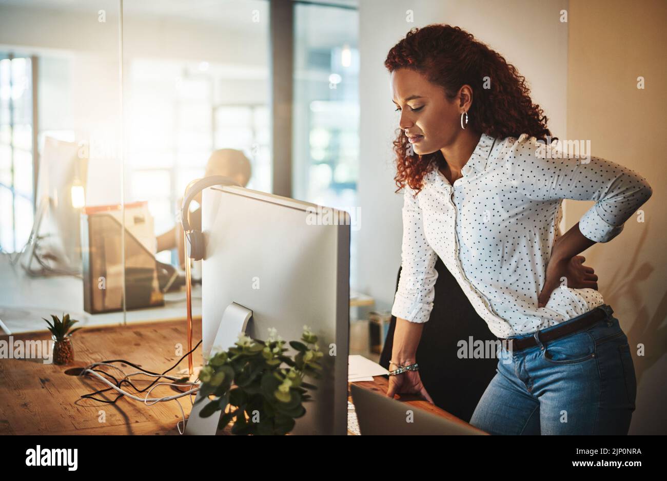 When productivity comes at a cost. a young businesswoman suffering from ...