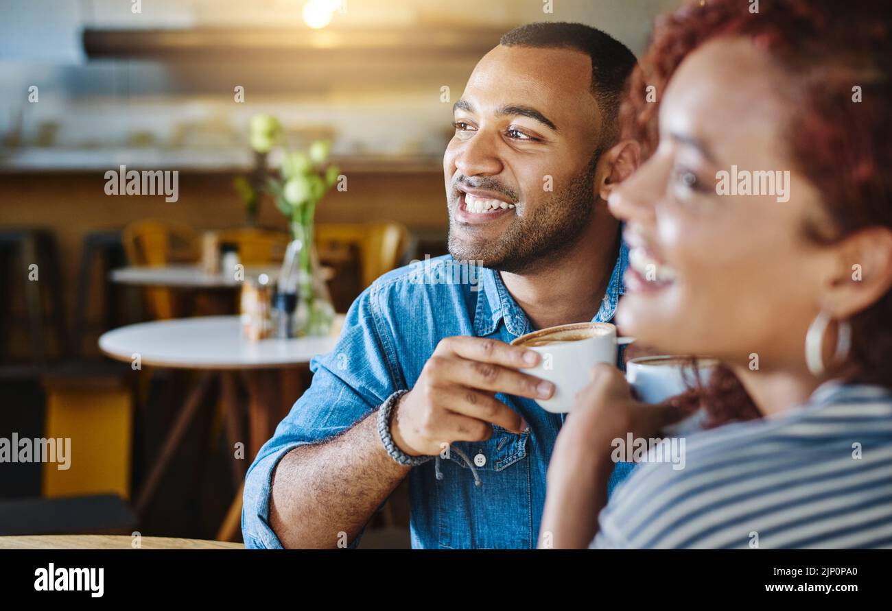 Looking for their waiter. a handsome young man spending time with his ...