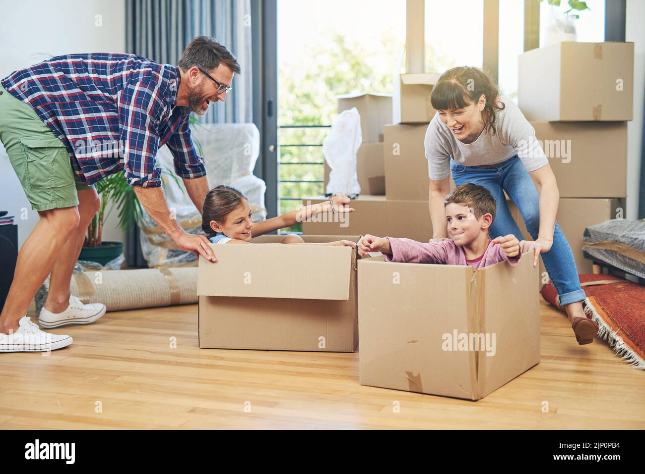 Get the kids involved and making moving day fun. a happy family having ...