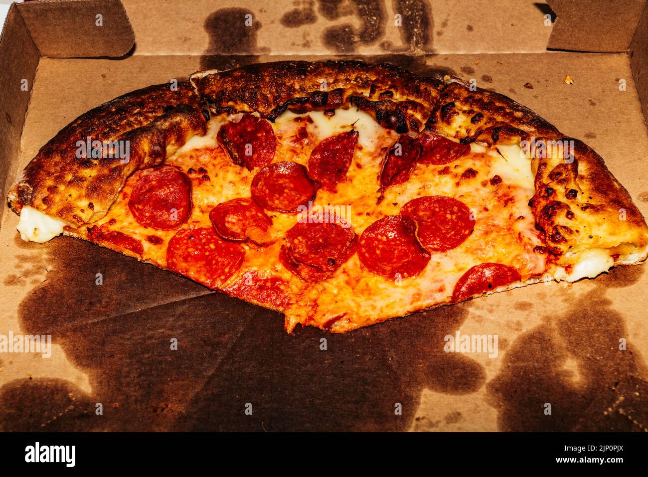 A close up of a slice of pizza Stock Photo - Alamy