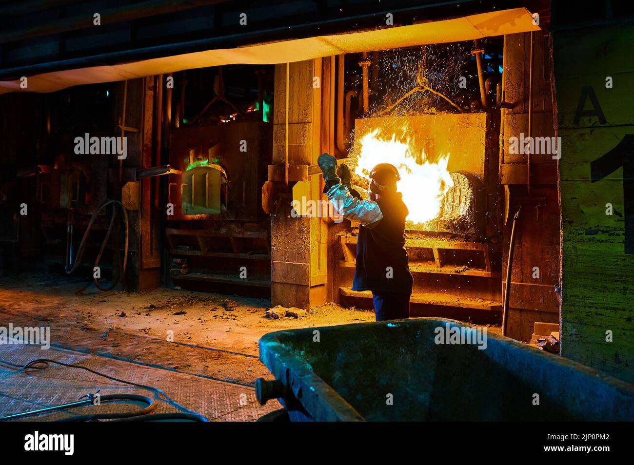 The process of refining copper melt in a reverberatory furnace. Teasing ...