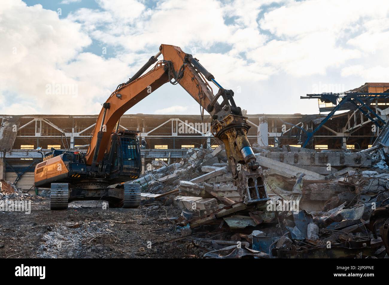 Hydraulic excavator removes concrete hi-res stock photography and ...