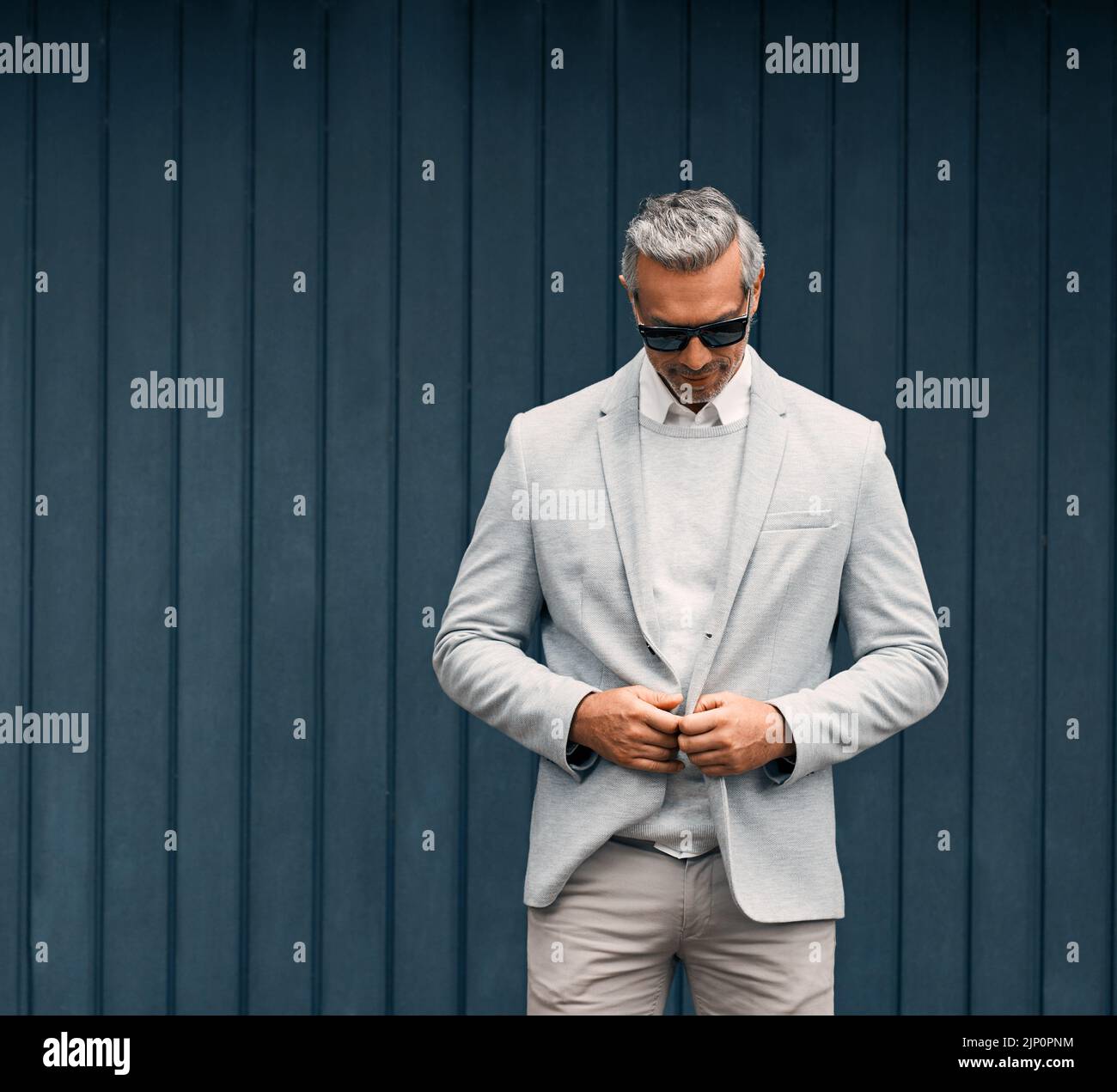 Looking suave and sophisticated. a smartly dressed mature businessman ...