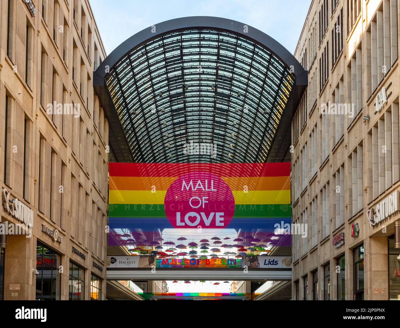 Mall of Berlin shopping center with a huge LGBTQ banner. A worldwide symbol for tolerance and ...