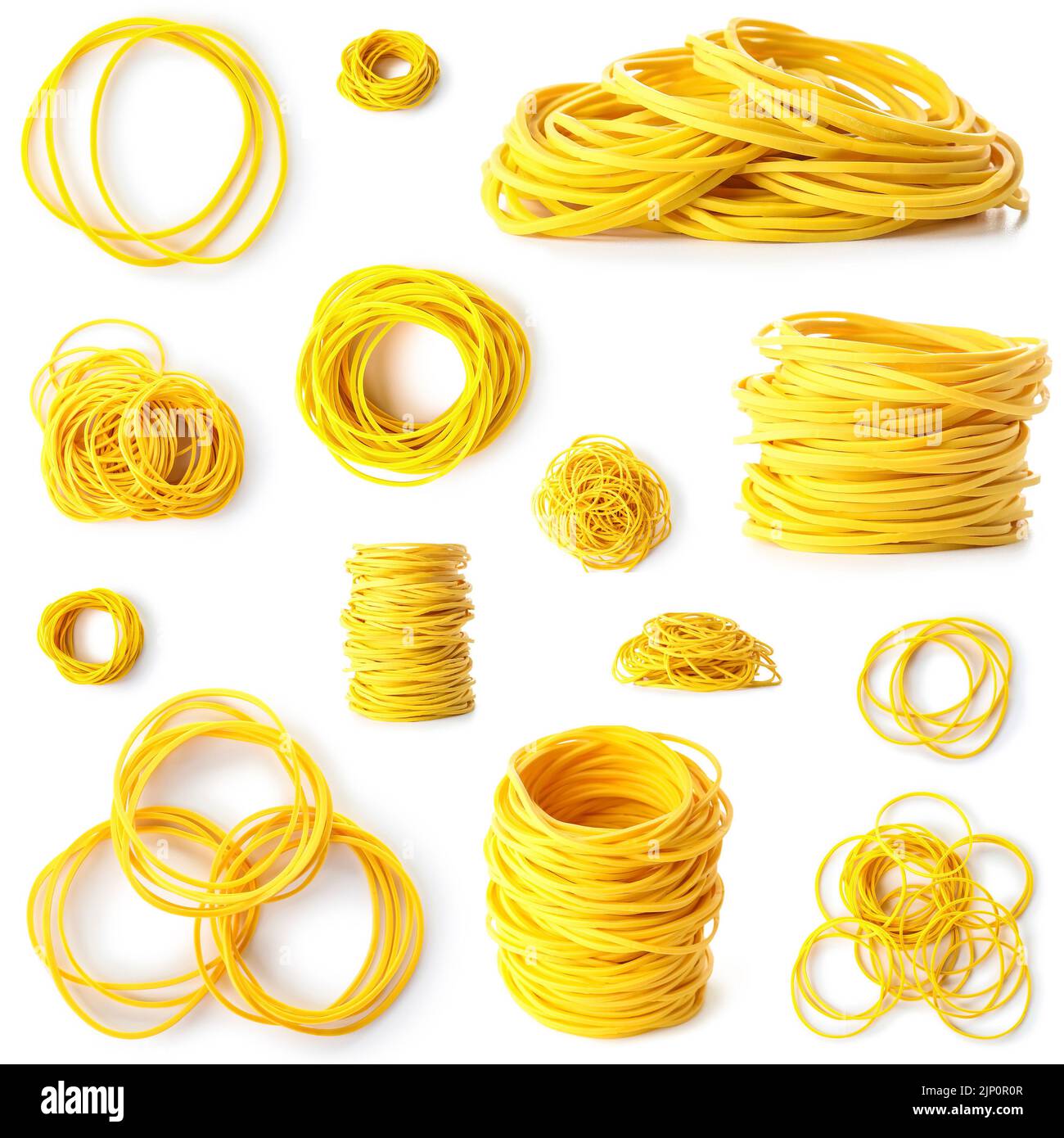 Collection of yellow elastic bands on white background Stock Photo - Alamy