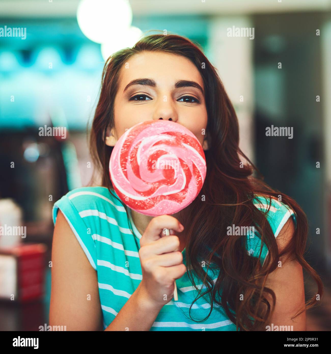 Im a candy kinda girl. Cropped portrait of an attractive young woman ...