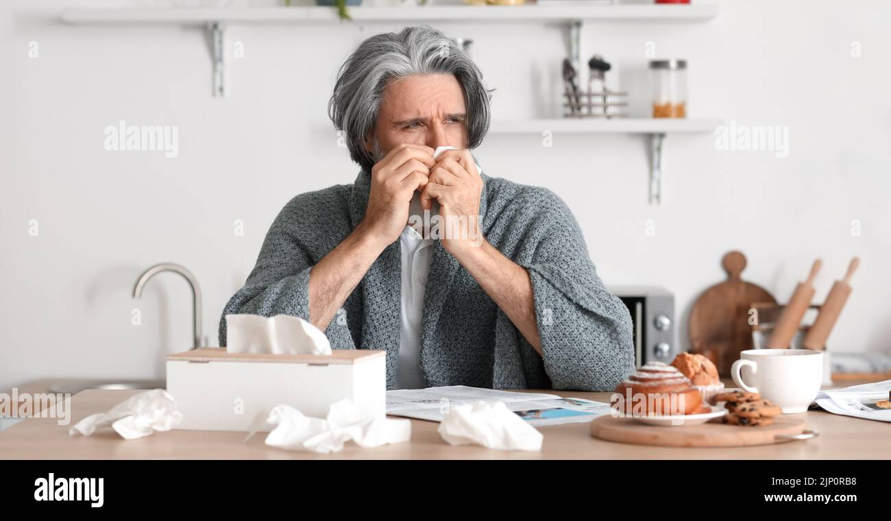 Sick old man coughing sitting hi-res stock photography and images - Alamy