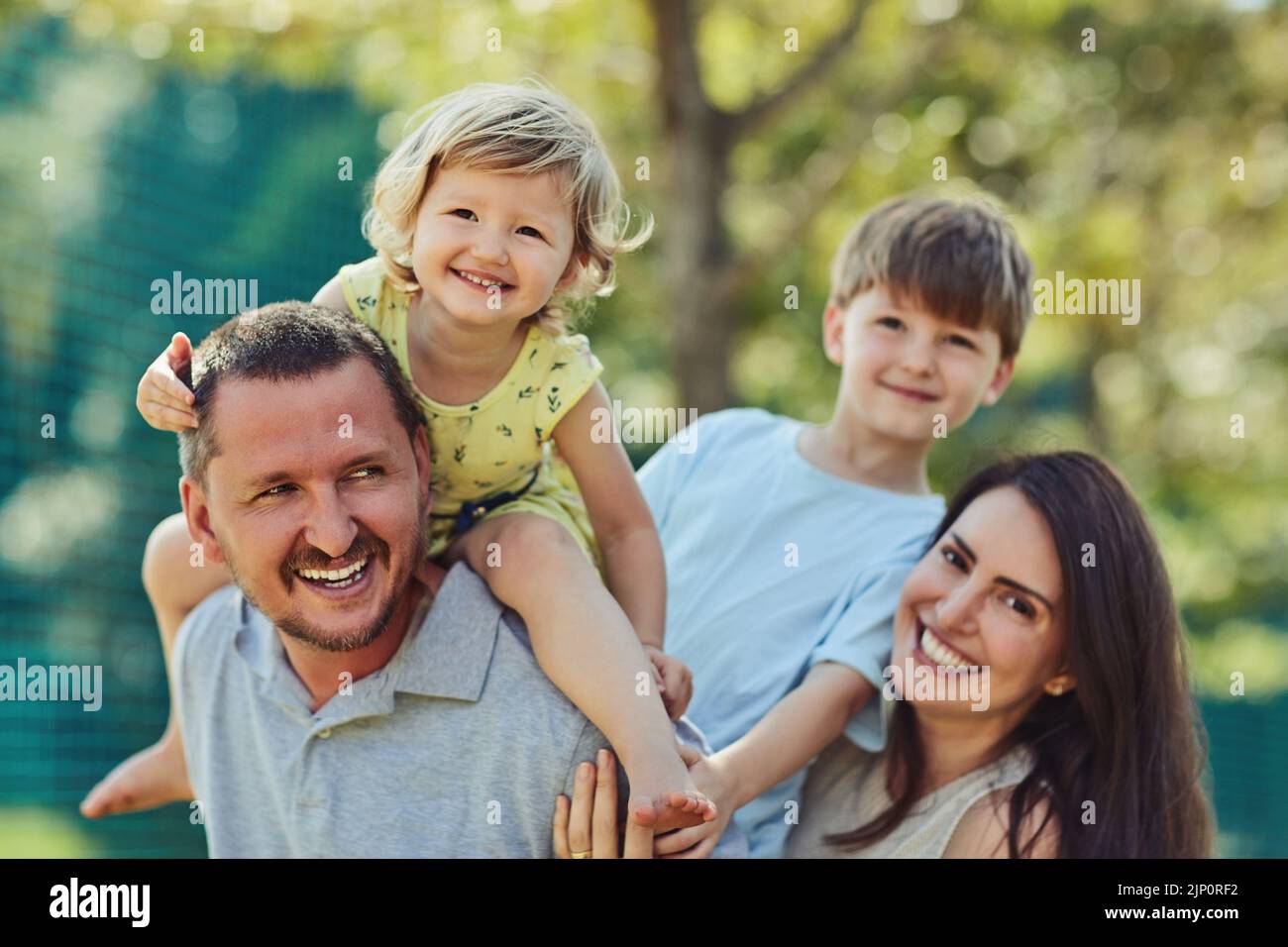 Love them unconditionally. a happy family bonding together outdoors ...