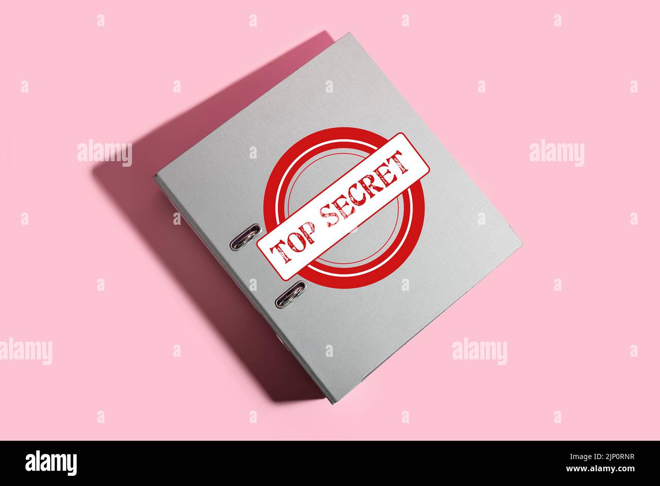 Folder with top secret documents on pink background Stock Photo - Alamy