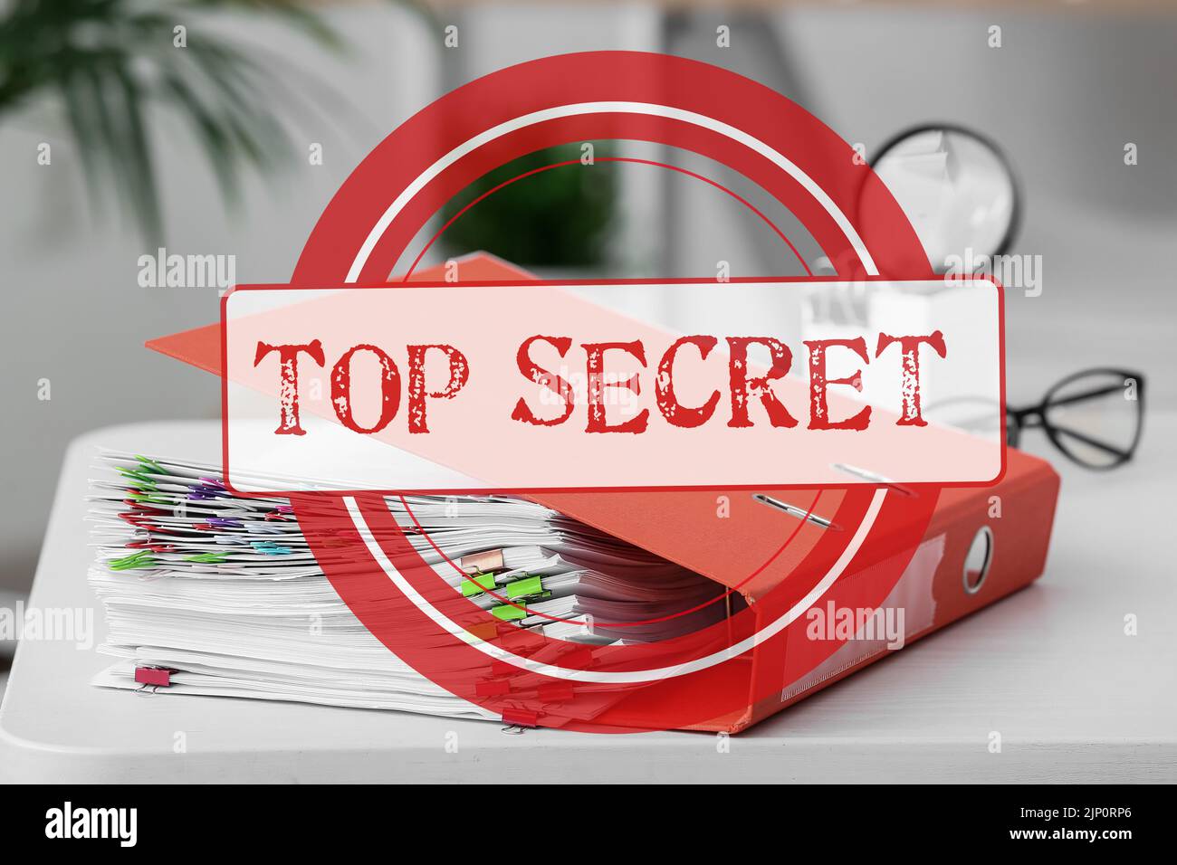 Folder with top secret documents on table in office Stock Photo - Alamy