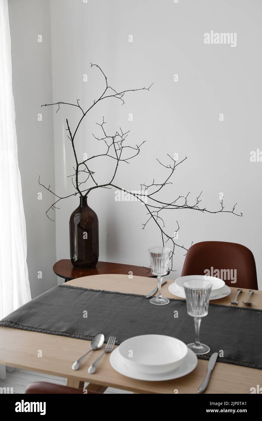 Beautiful table setting in room Stock Photo - Alamy