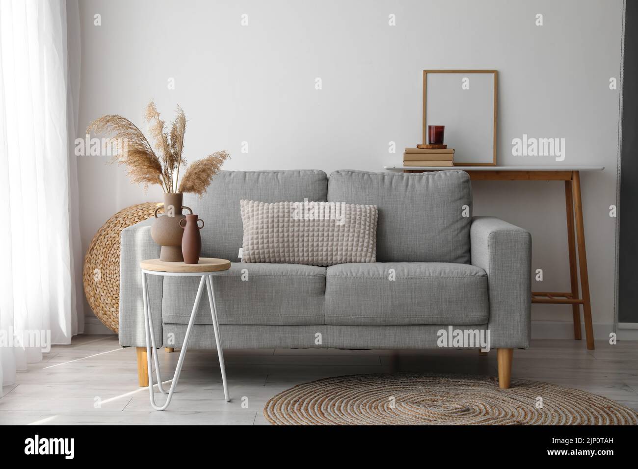 Interior of modern living room with sofa and table near window Stock ...