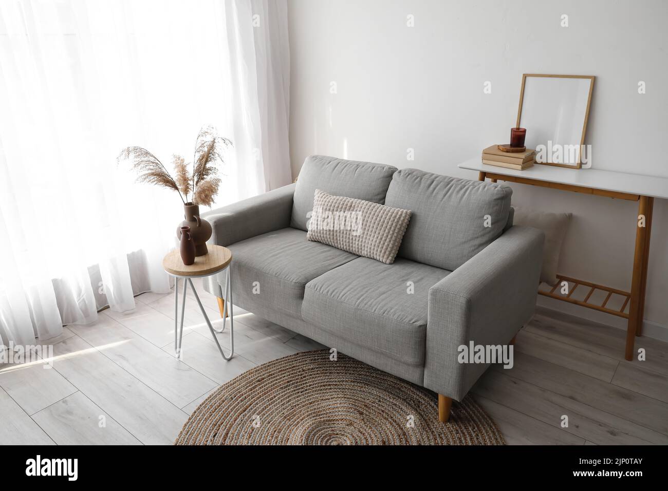 Interior of modern living room with sofa and table near window Stock ...