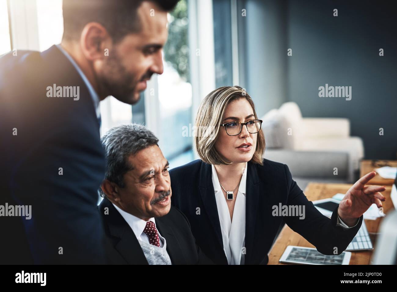 Its almost ready for the client. colleagues working together in a ...