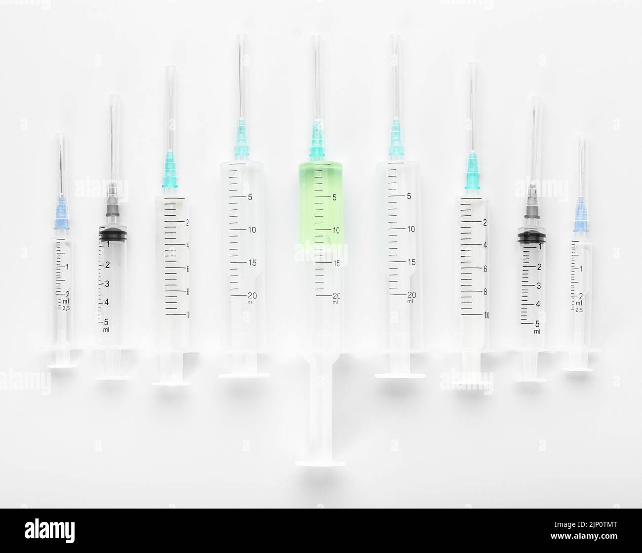 Different medical syringes with vaccine on white background Stock Photo ...