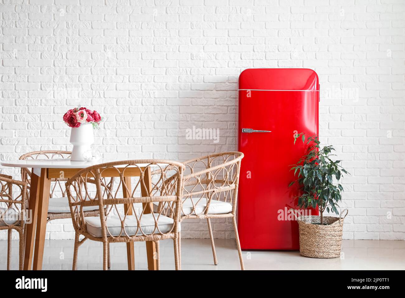 Stylish retro fridge in interior of dining room Stock Photo - Alamy