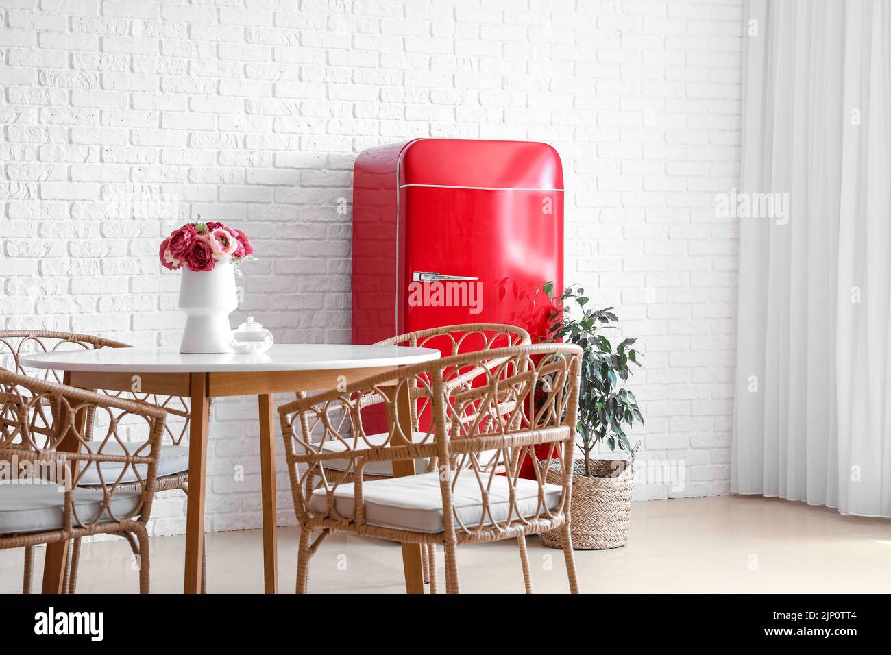 Stylish retro fridge in interior of dining room Stock Photo - Alamy