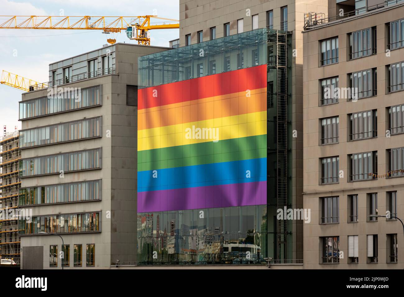 Rainbow flag on a building facade in Berlin city. LGBTQ symbol to show ...