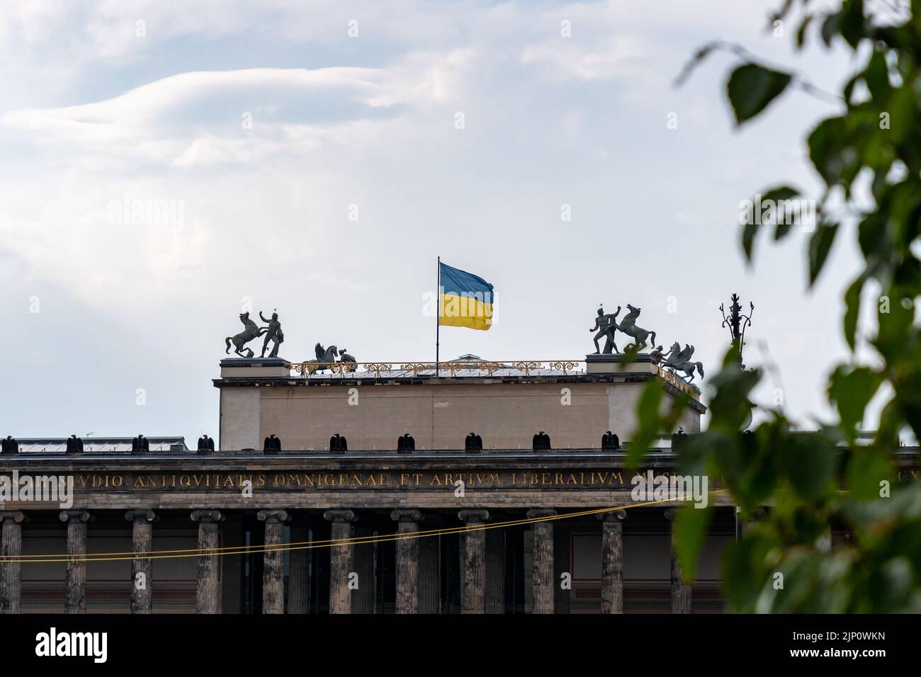 Ukrainian flag on the building of the museum island in the city. The ...