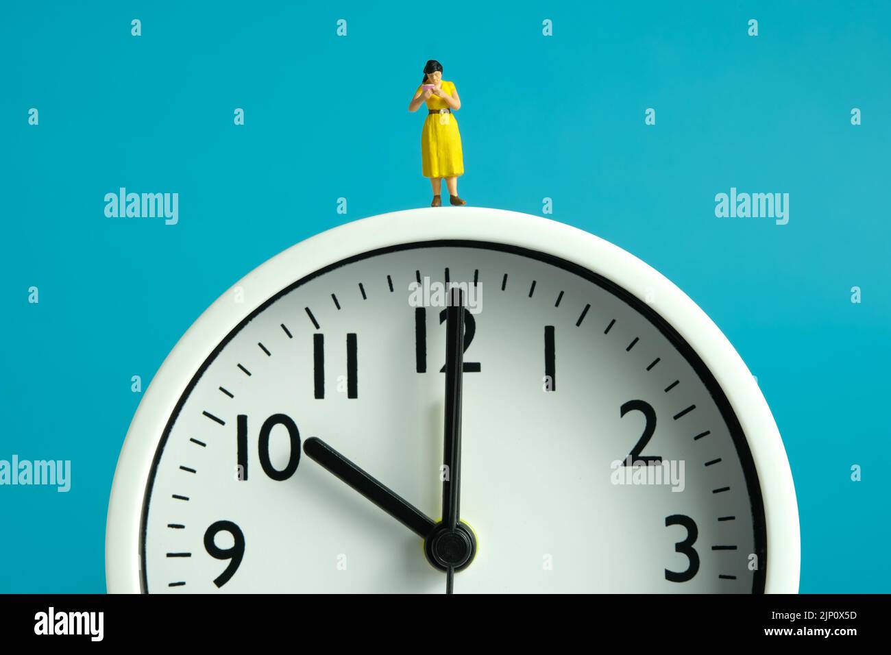 Miniature people toy figure photography. Reading routine concept. A ...