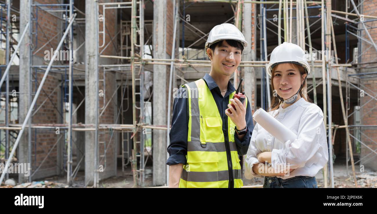 Structural engineer and architect discussing and working with ...