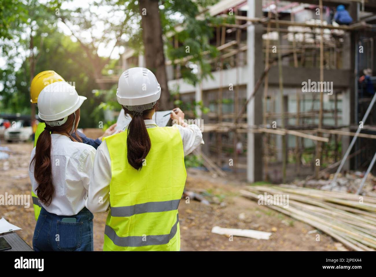 Structural engineer and architect discussing and working with ...