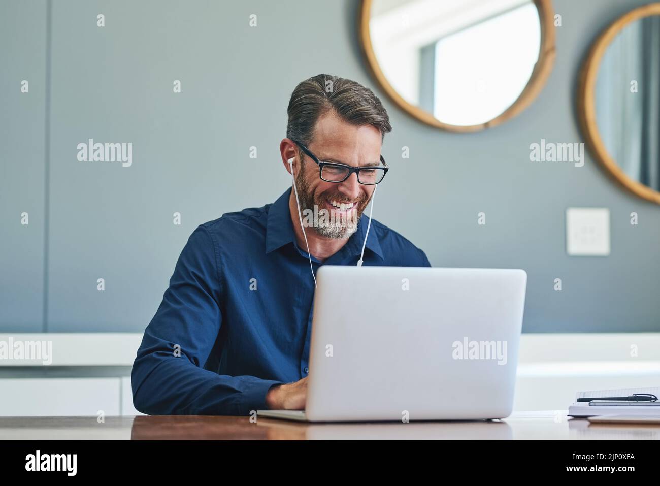 Getting work done well makes me happy. a cheerful middle aged ...