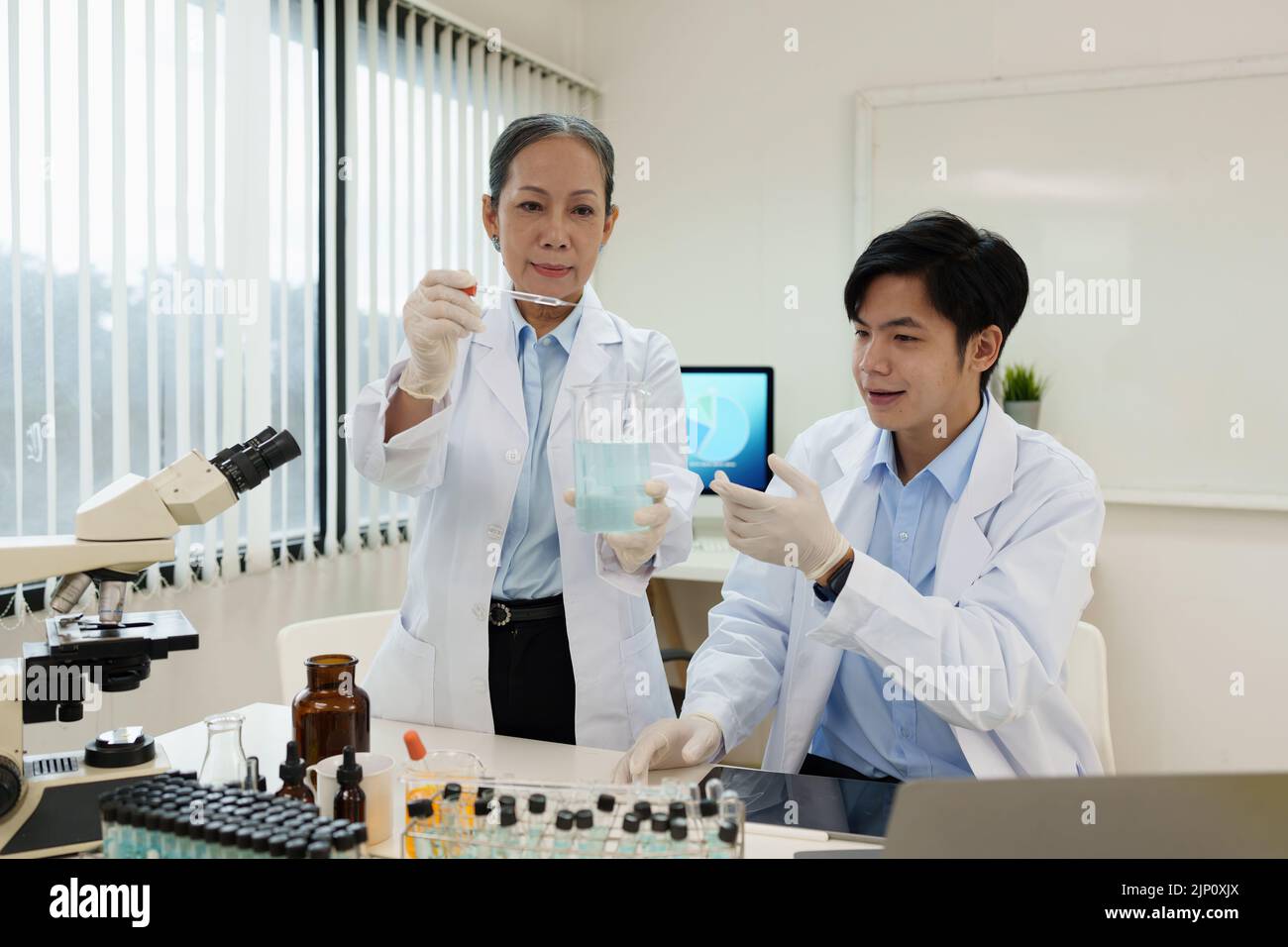 Health care researchers working in life of medical science laboratory ...