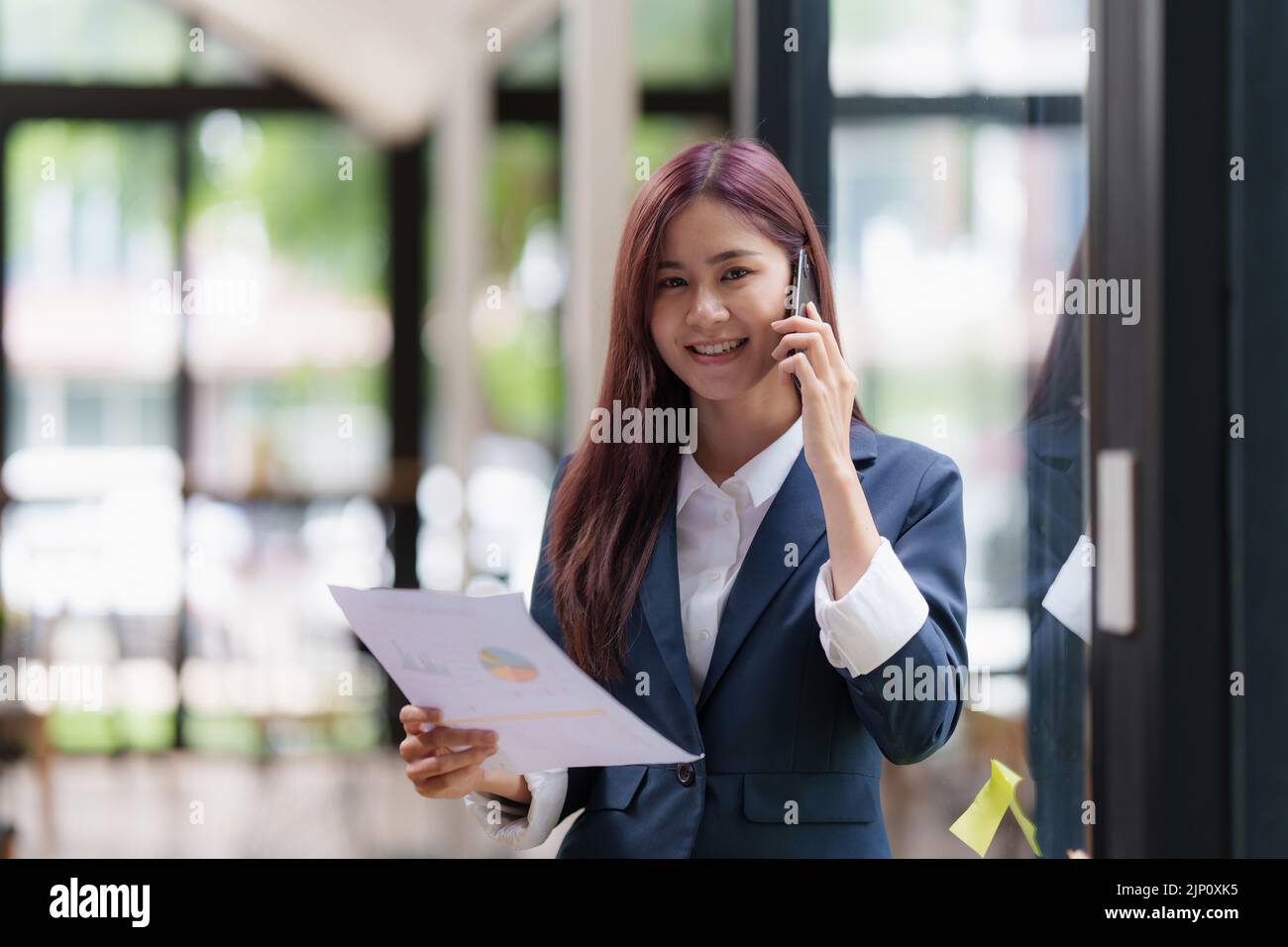 Business woman making business call talking on phone. Account and ...