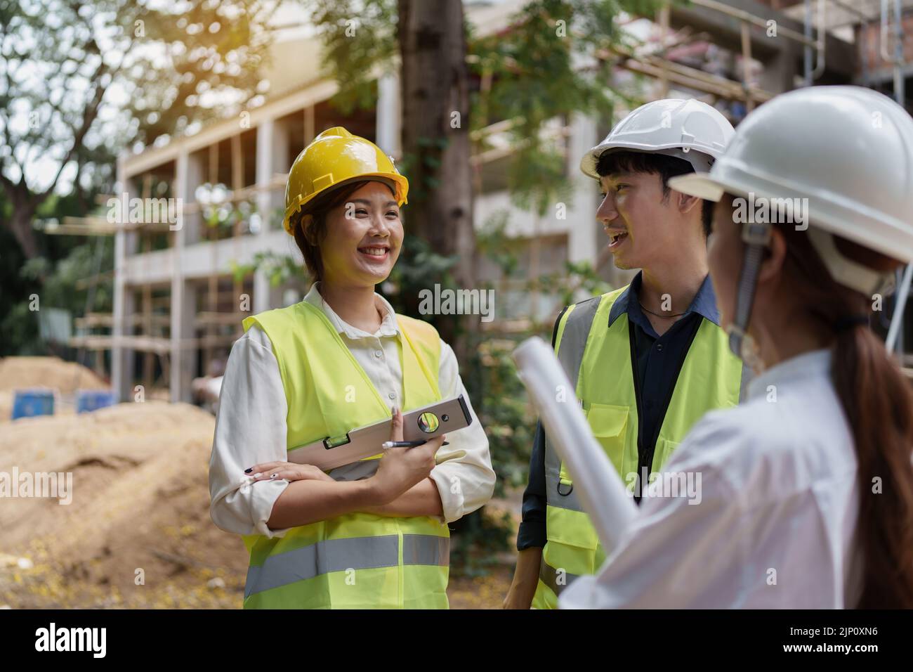 Structural engineer and architect discussing and working with ...