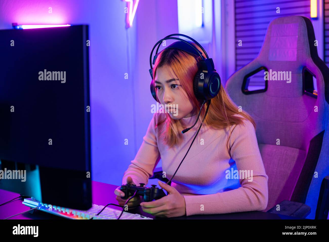 You win. Gamer using joystick controller plays online video game with ...